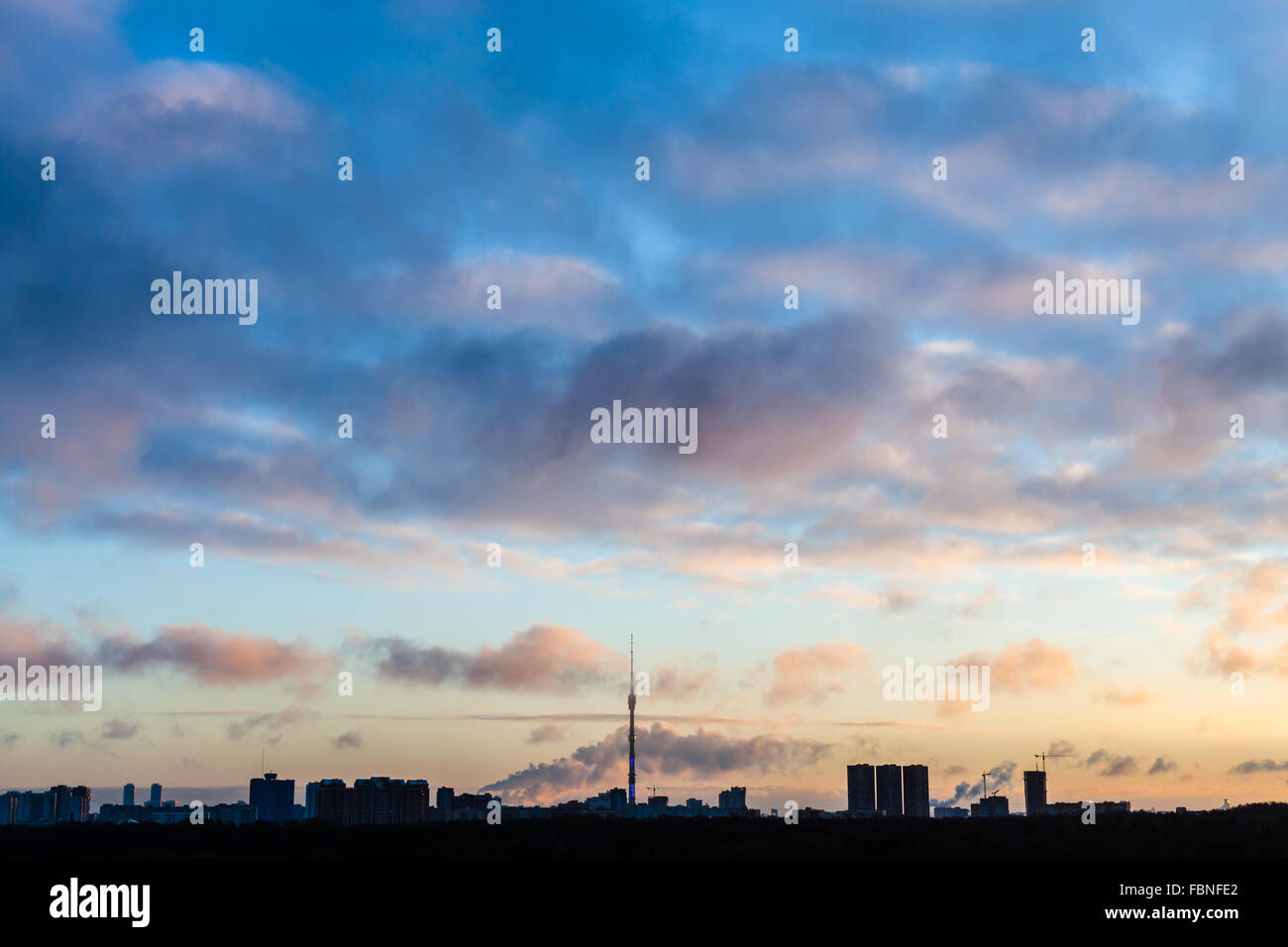 dark blue sky with clouds over city in cold winter sunrise Stock Photo ...