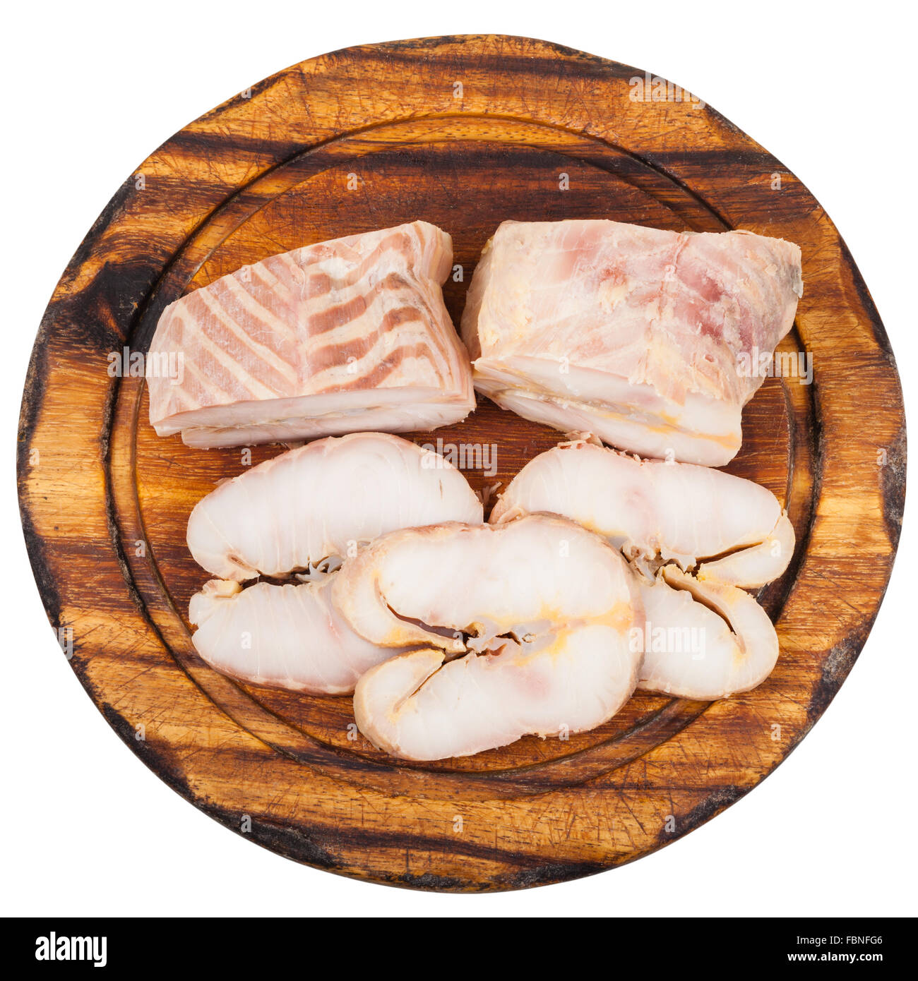 top view of pieces and slices of hot smoked Starry sturgeon and ...
