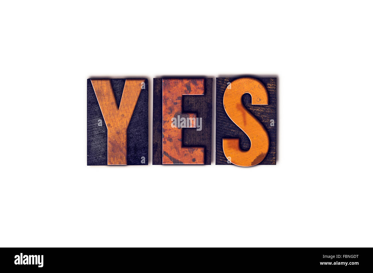 The word "Yes" written in isolated vintage wooden letterpress type on a ...