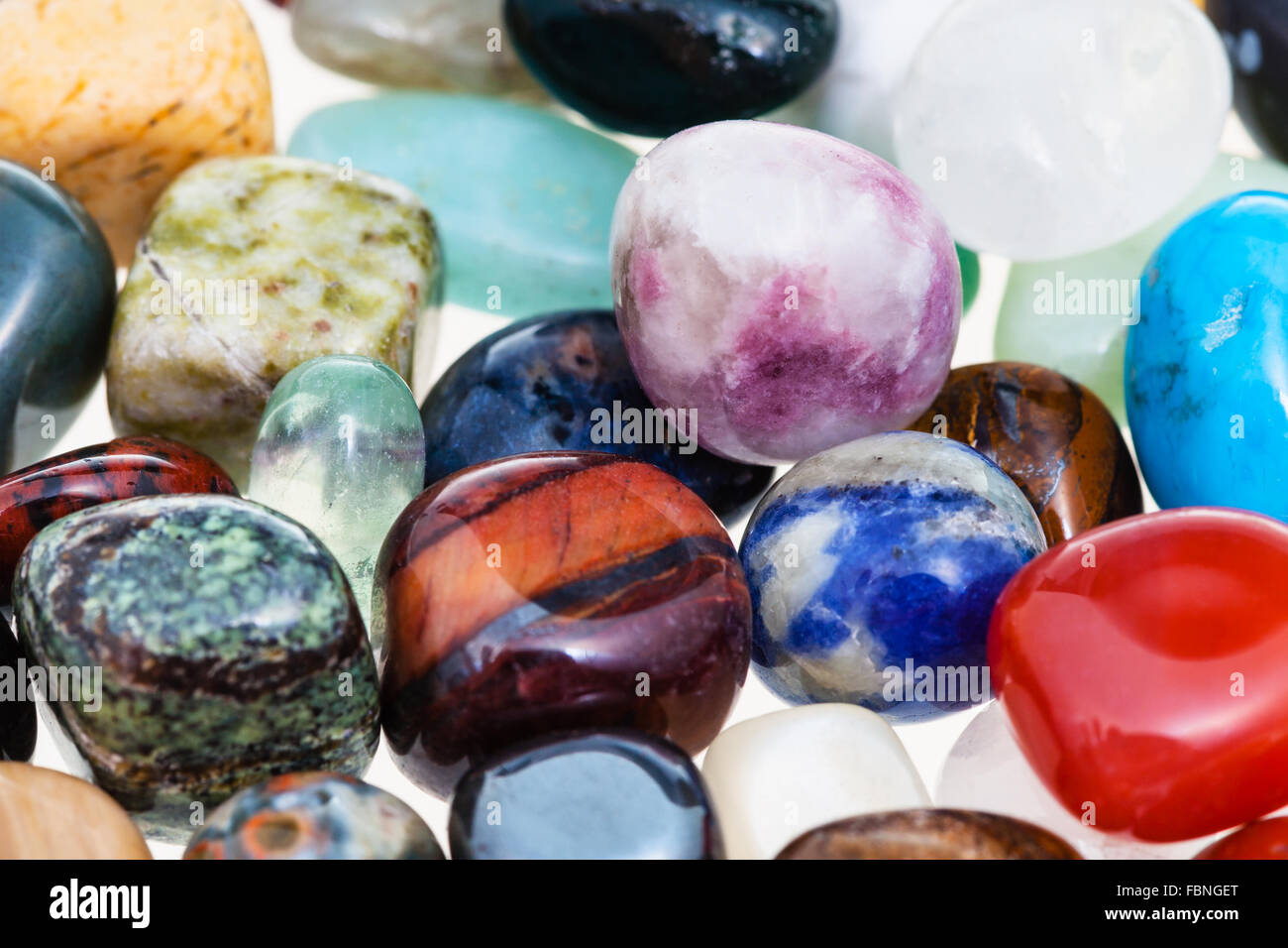 handful of various gem stones close up on white background Stock Photo ...