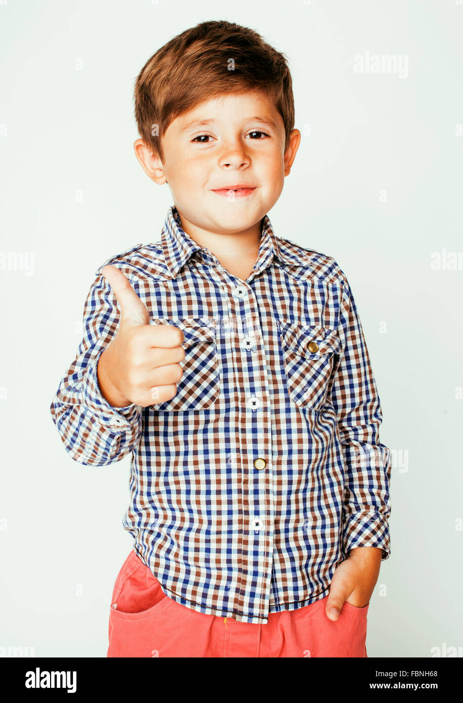 little cute real boy on white background gesture smiling close up Stock ...