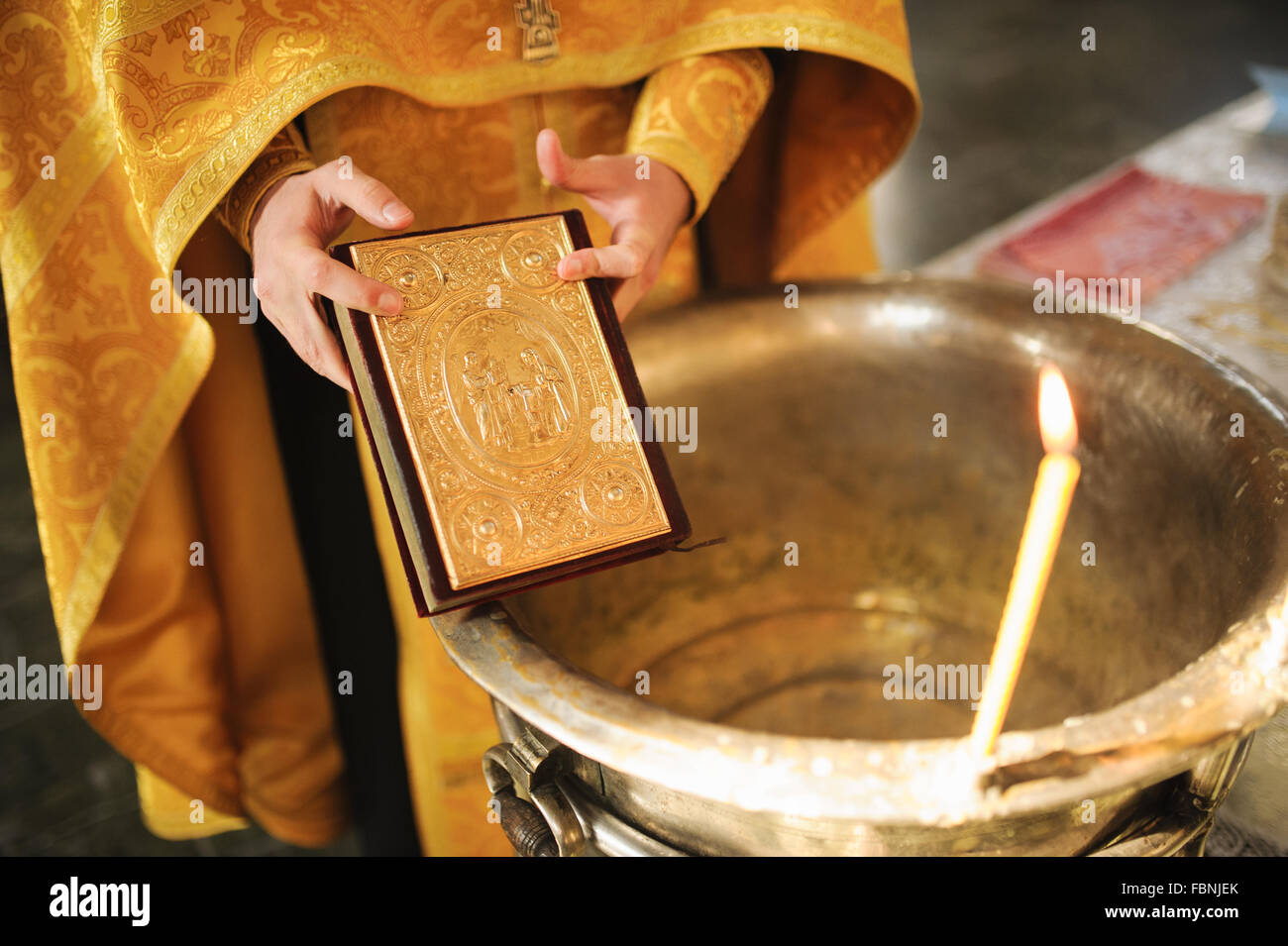 Orthodox priest during christening baptism Stock Photo - Alamy