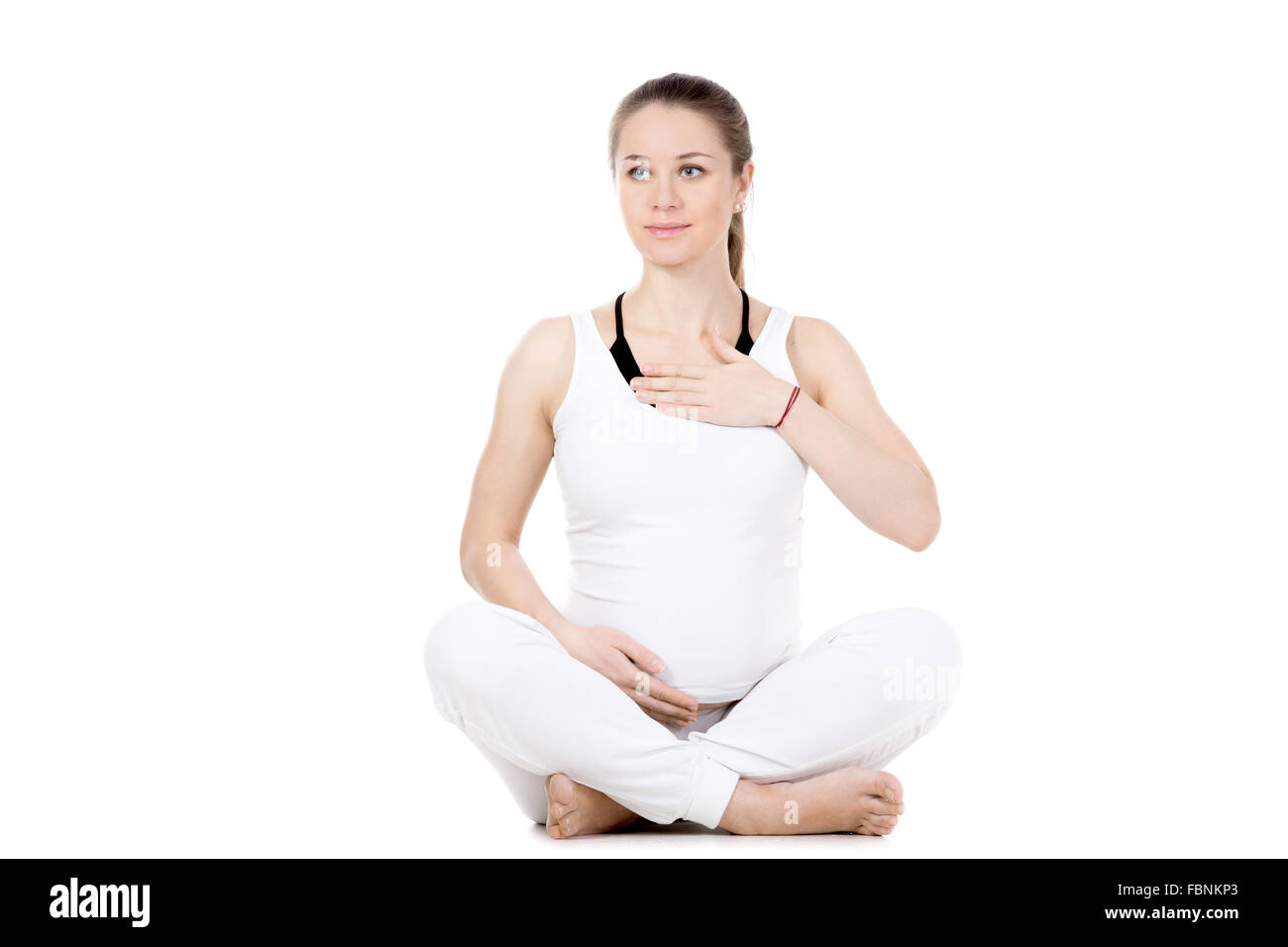 Full length portrait of happy young pregnant fitness model in ...