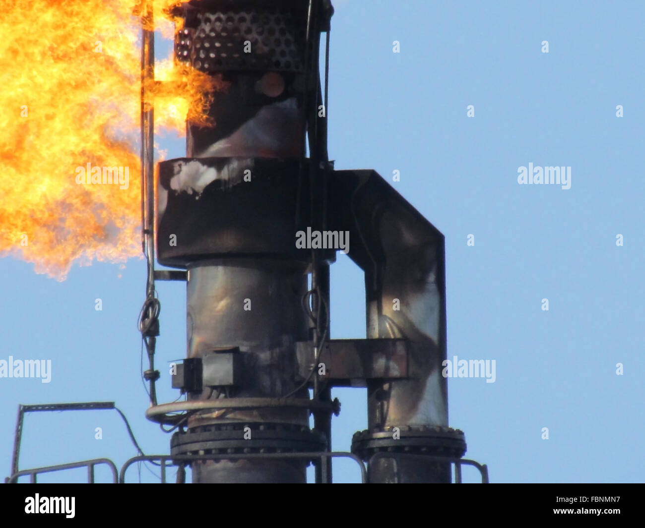 System of a torch on an oil field. Burning through a torch head Stock ...