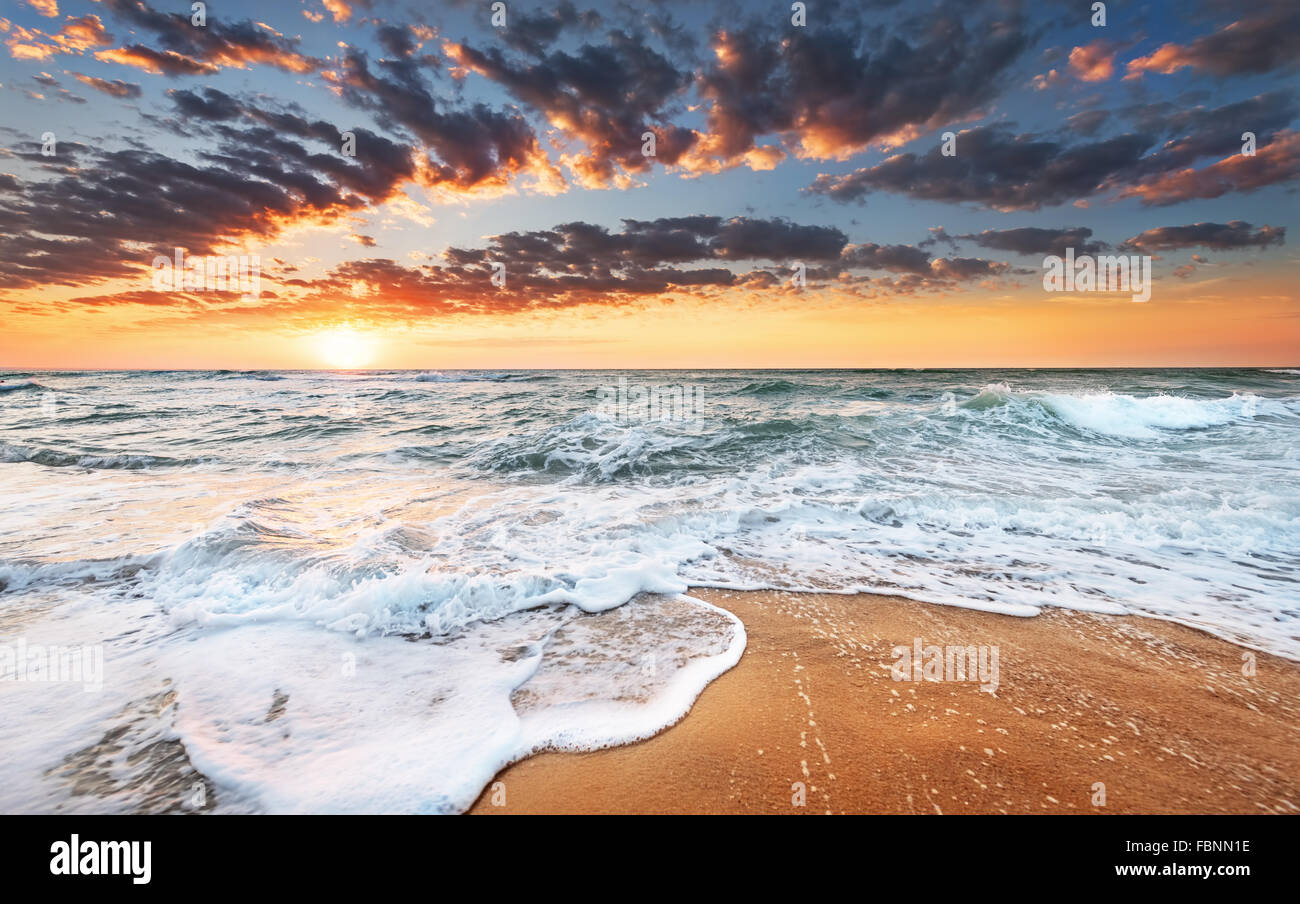 atmosphere at sunrise on the beach Stock Photo - Alamy