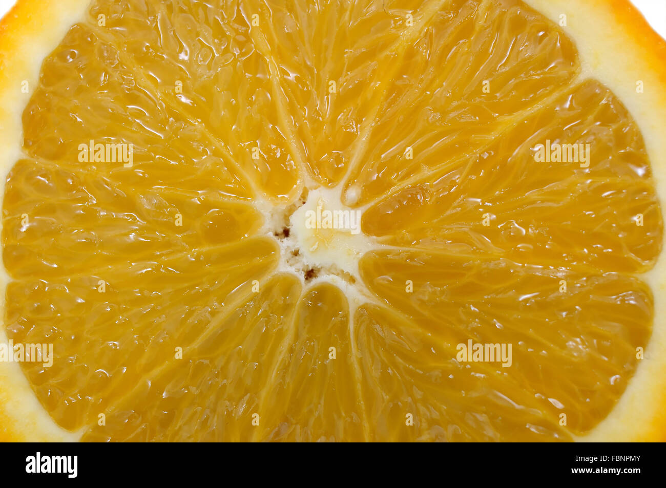 Juicy yellow orange in the context of a close-up Stock Photo - Alamy