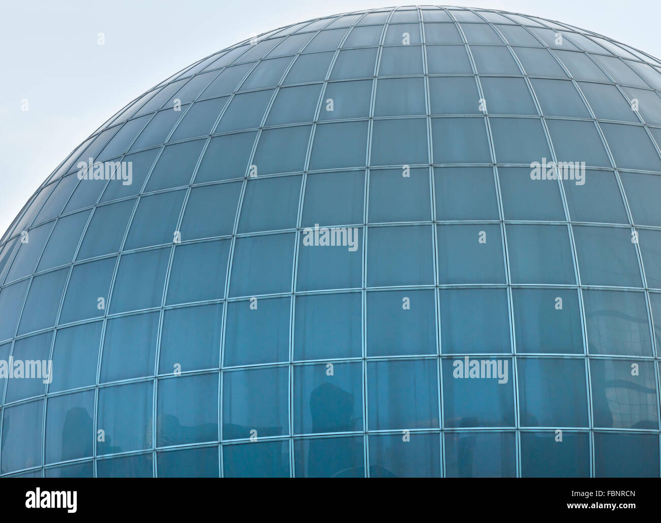 Wall of building in ball form with great number of windows ...