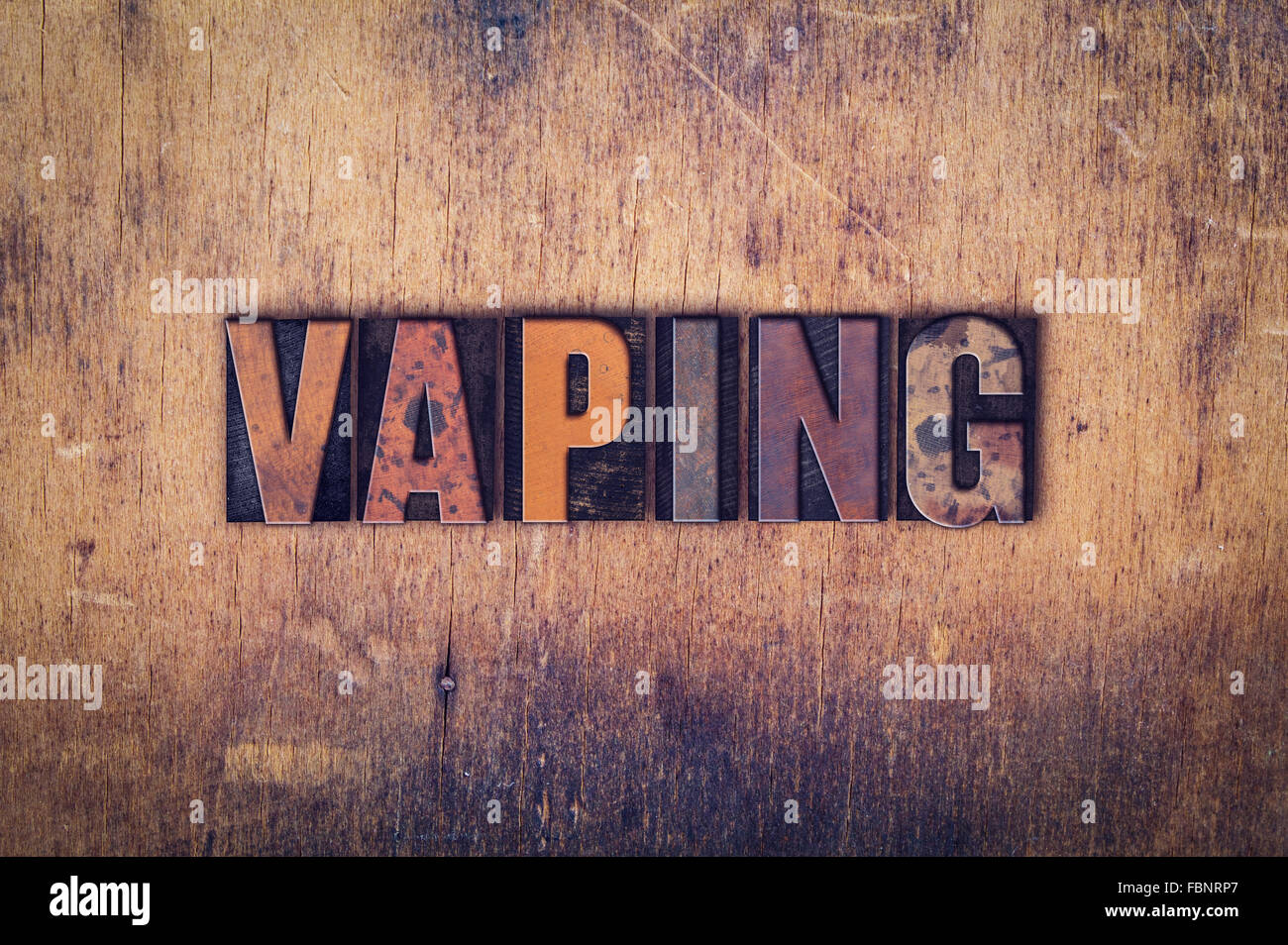 The word "Vaping" written in dirty vintage letterpress type on a aged ...