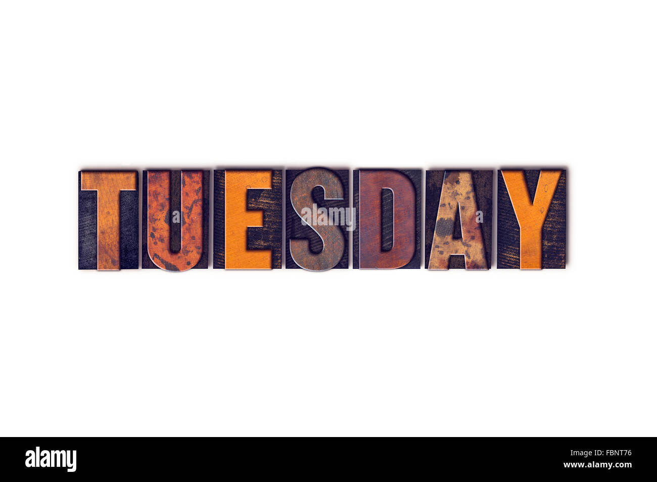 The word "Tuesday" written in isolated vintage wooden letterpress type ...