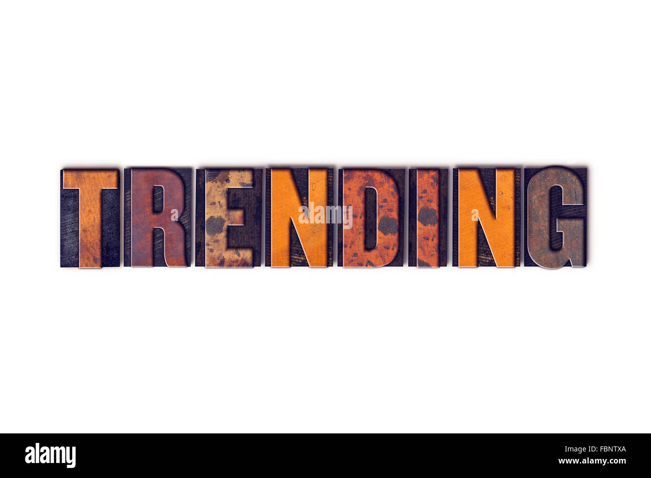 The word "Trending" written in isolated vintage wooden letterpress type ...