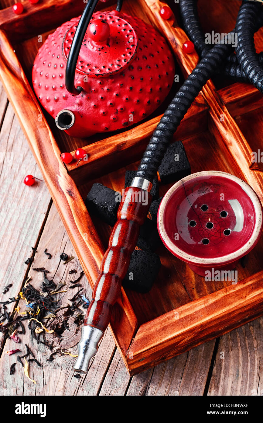 Details of smoking hookah,cast iron red teapot in wooden box Stock ...