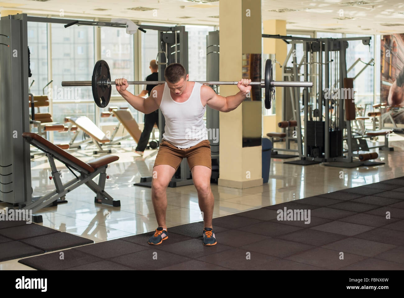 Gym biceps man bodybuilder barbells hi-res stock photography and images ...