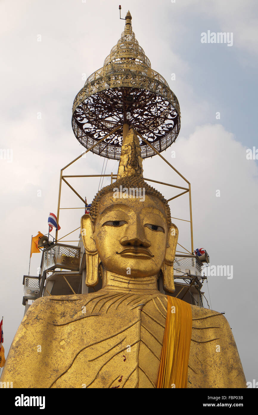 Head and shoulders of a 32 m. high standing golden Buddha, temple ...