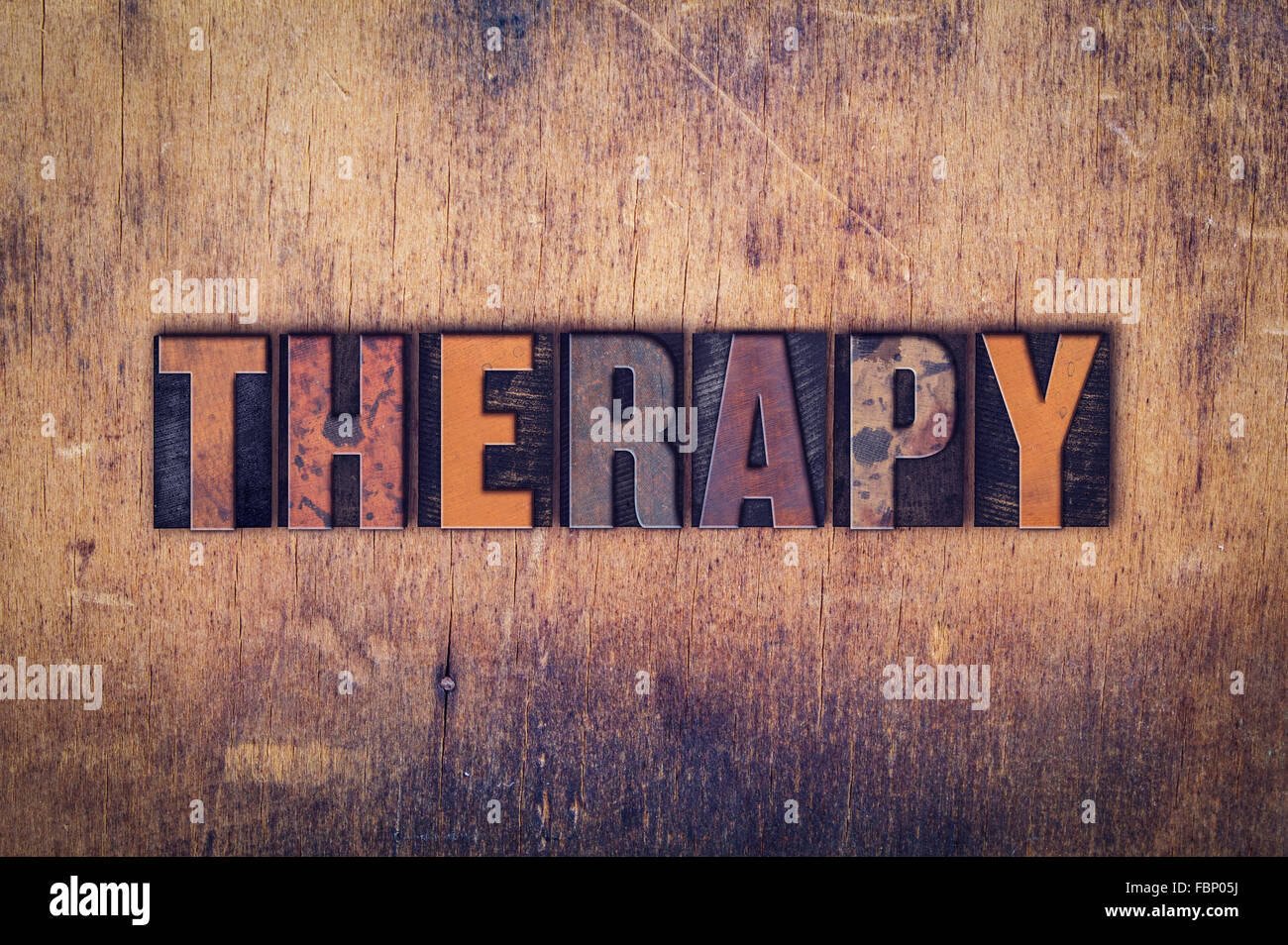 The word "Therapy" written in dirty vintage letterpress type on a aged ...