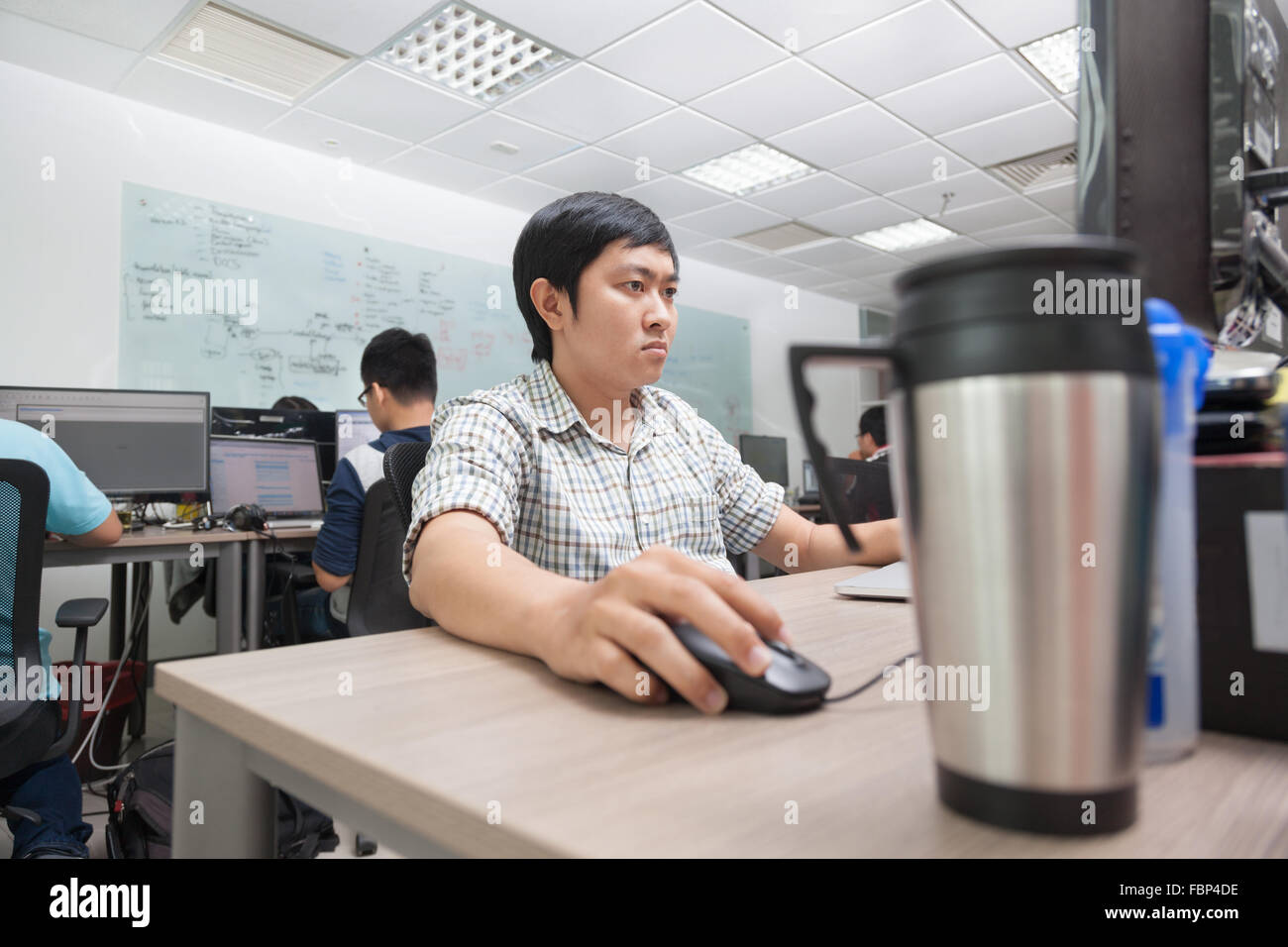 Asian Developer Using Laptop Computer Sitting Working Stock Photo - Alamy Asian Developer Using Laptop Computer Sitting Working Stock Photo - Alamy