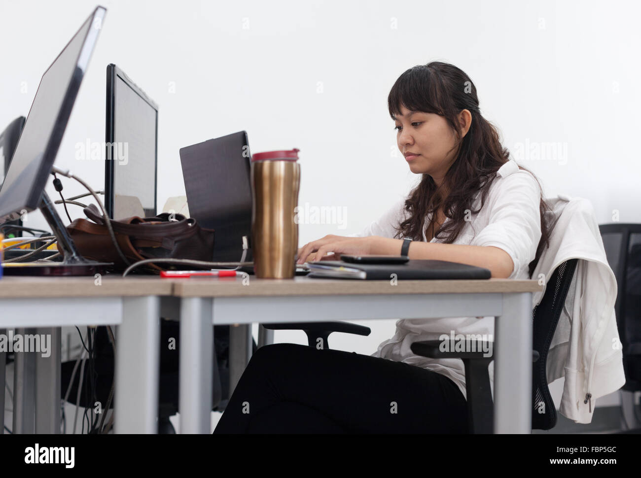Asian businesswoman working computer sitting office Stock Photo - Alamy