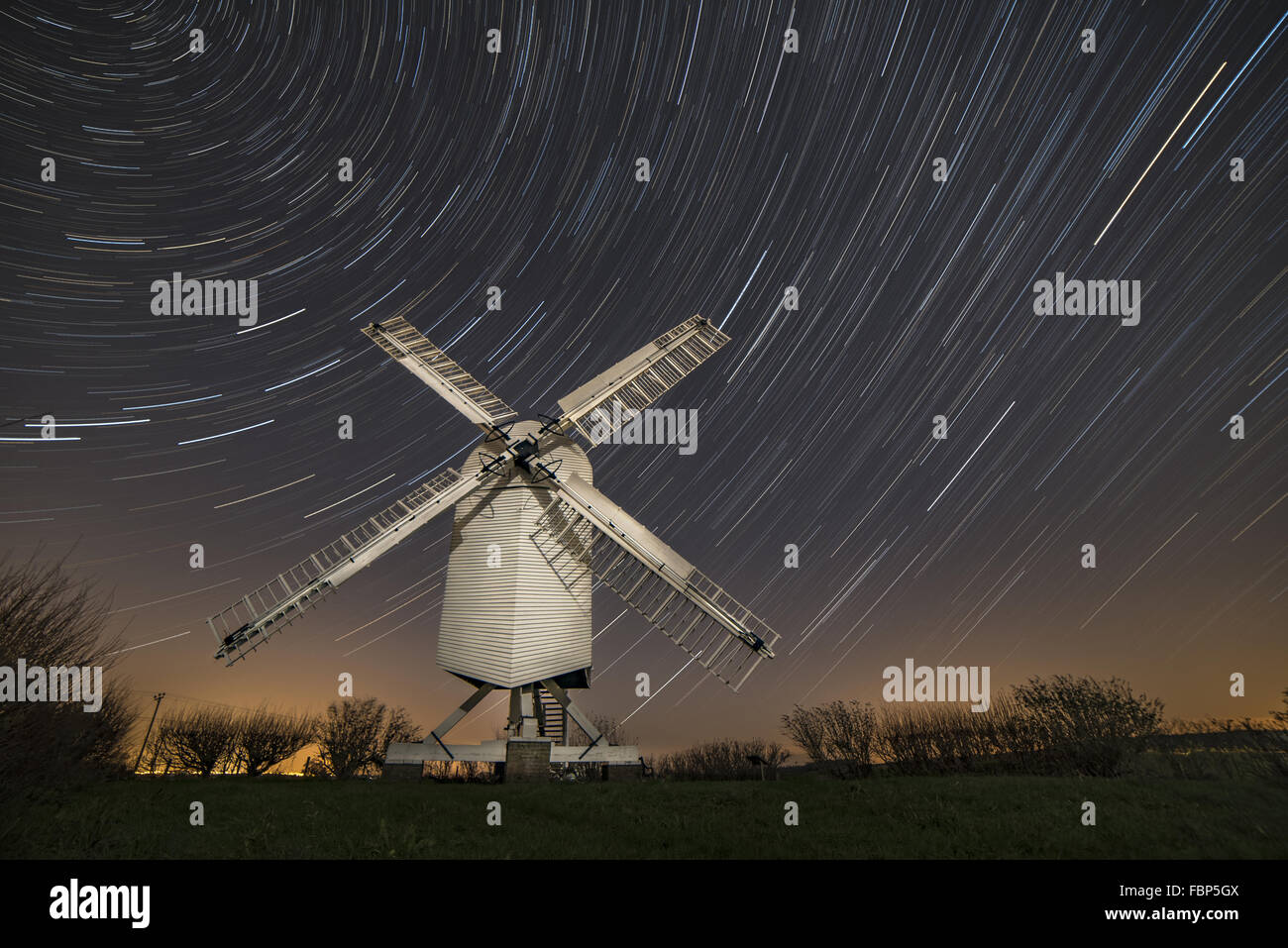 Chillenden windmill in Kent England lit by the moon with star trails ...