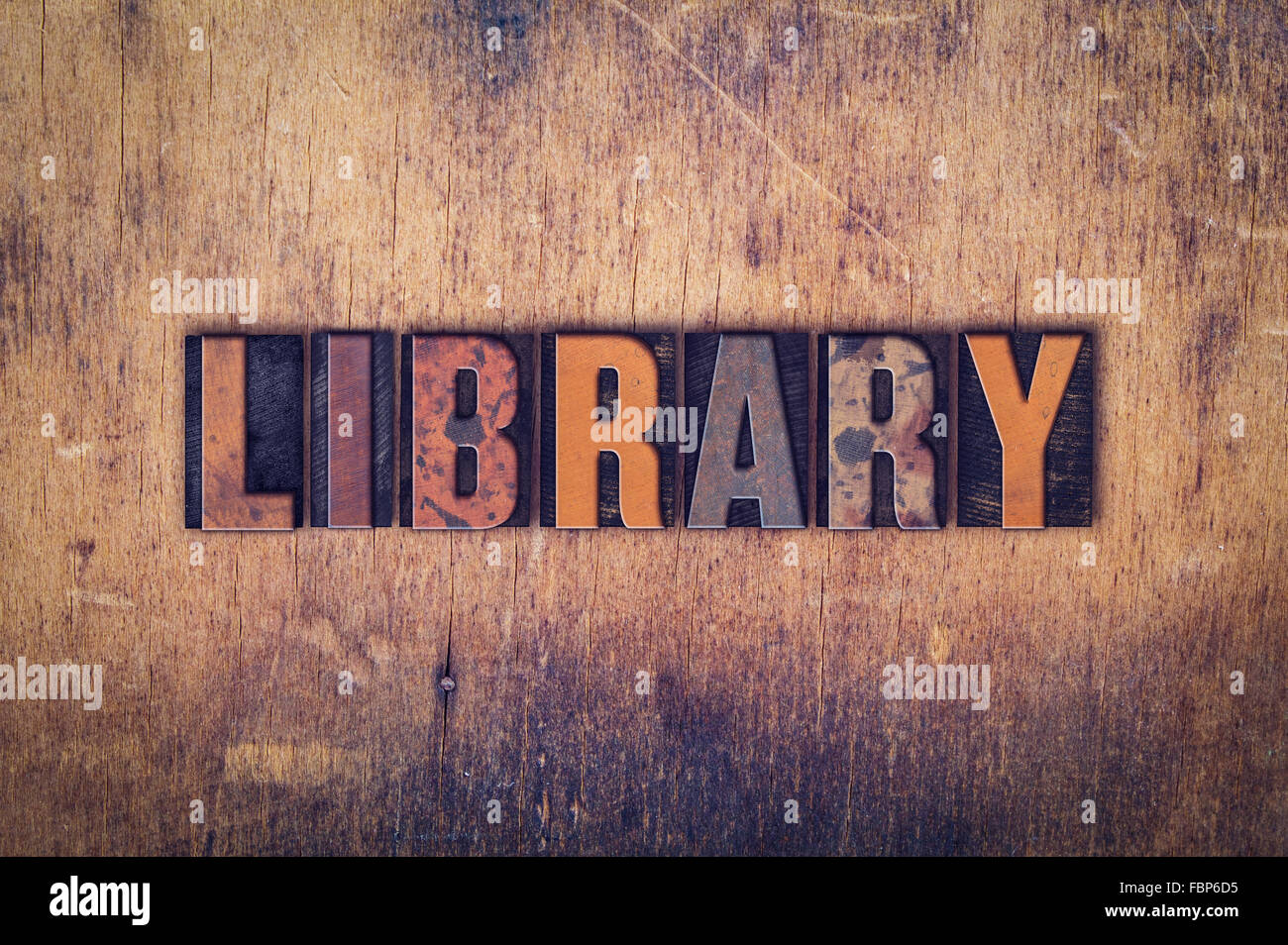 The word "Library" written in dirty vintage letterpress type on a aged ...