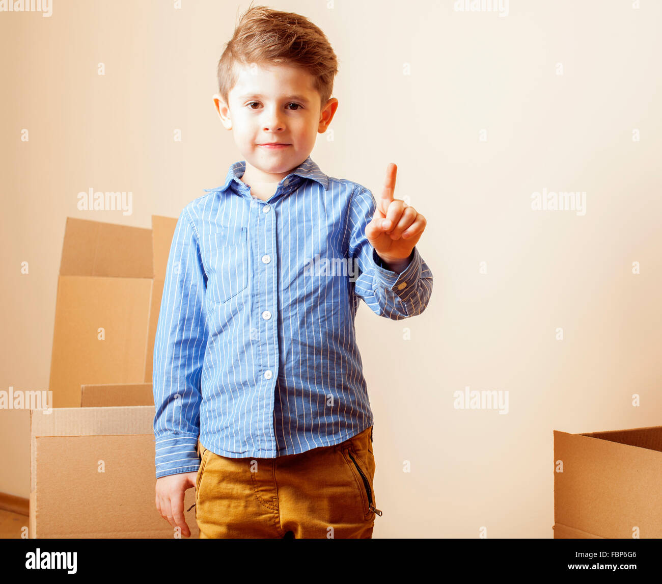 little cute boy in empty room, remoove to new house. home alone among ...