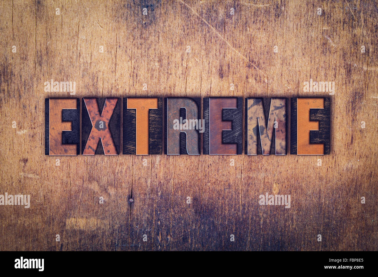 The word "Extreme" written in dirty vintage letterpress type on a aged ...