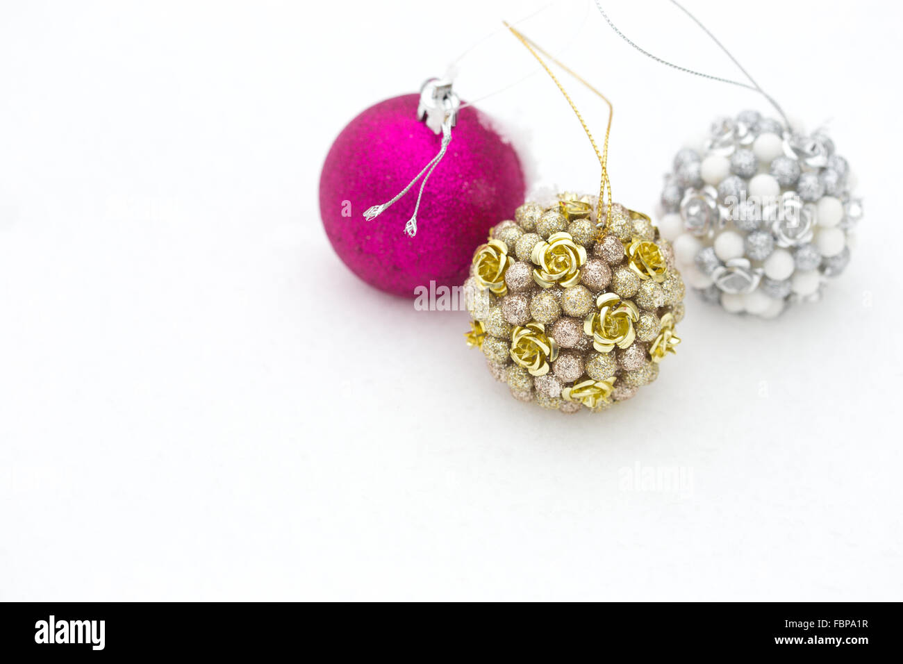 Three decorated christmas balls in the real snow. Winter outdoor Stock ...
