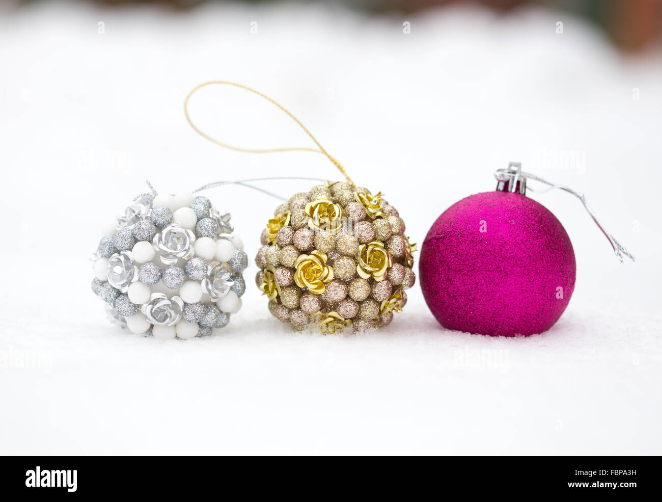 Three decorated christmas balls in the real snow. Winter outdoor Stock ...