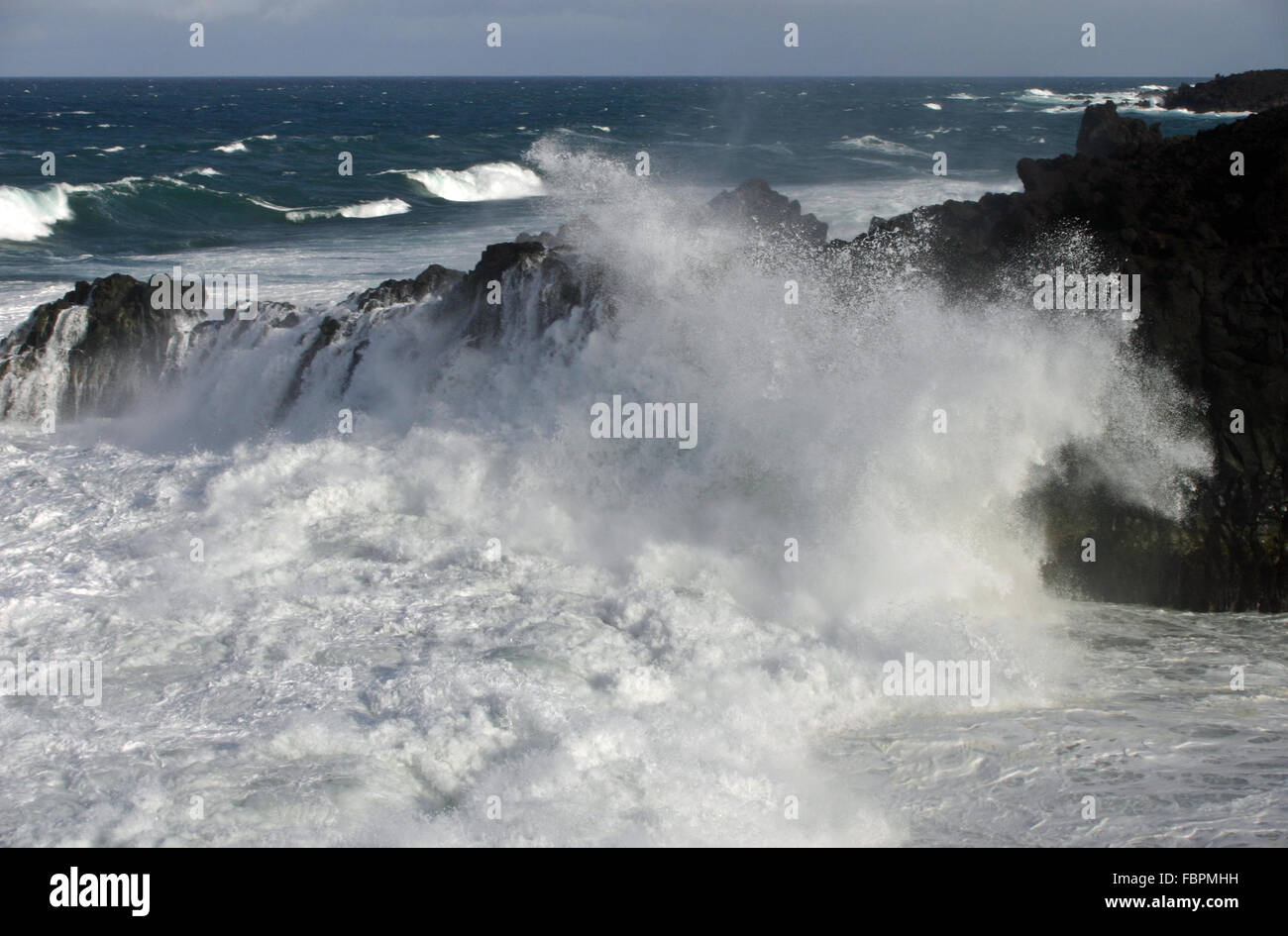 Waves crashing against cliffs Stock Photo - Alamy