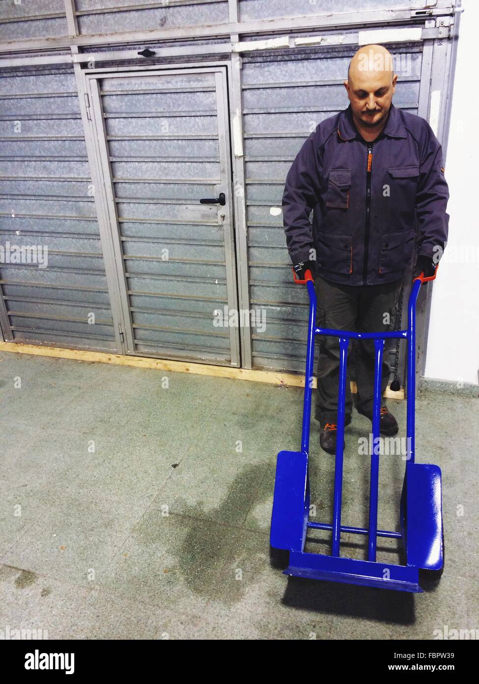 Person pushing trolley hi-res stock photography and images - Alamy