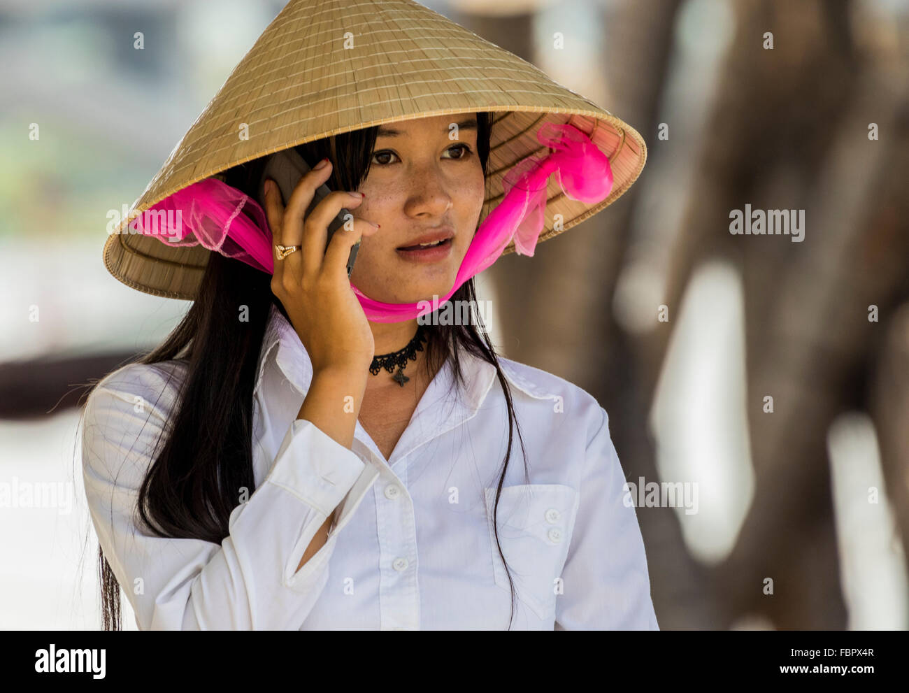Vietnamese lady on mobile phone in Mekong Delta Vietnam Stock Photo - Alamy