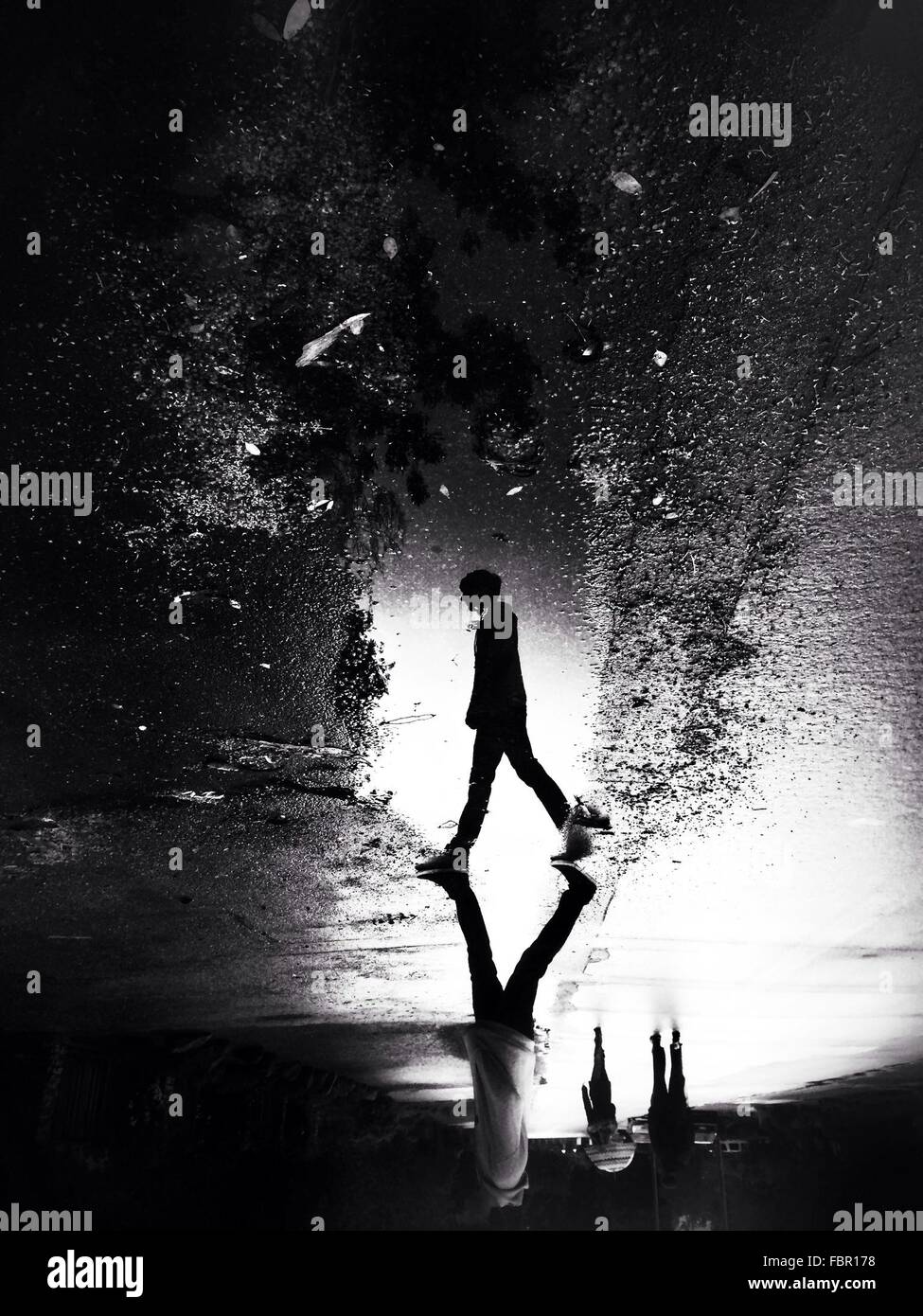 Reflection man in puddle street hi-res stock photography and images - Alamy
