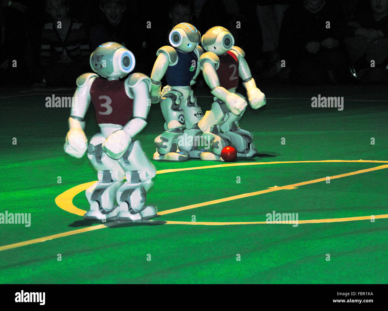 Robots playing football, soccer Stock Photo - Alamy