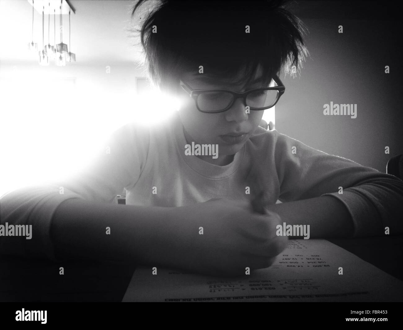 Boy reading at desk hi-res stock photography and images - Alamy