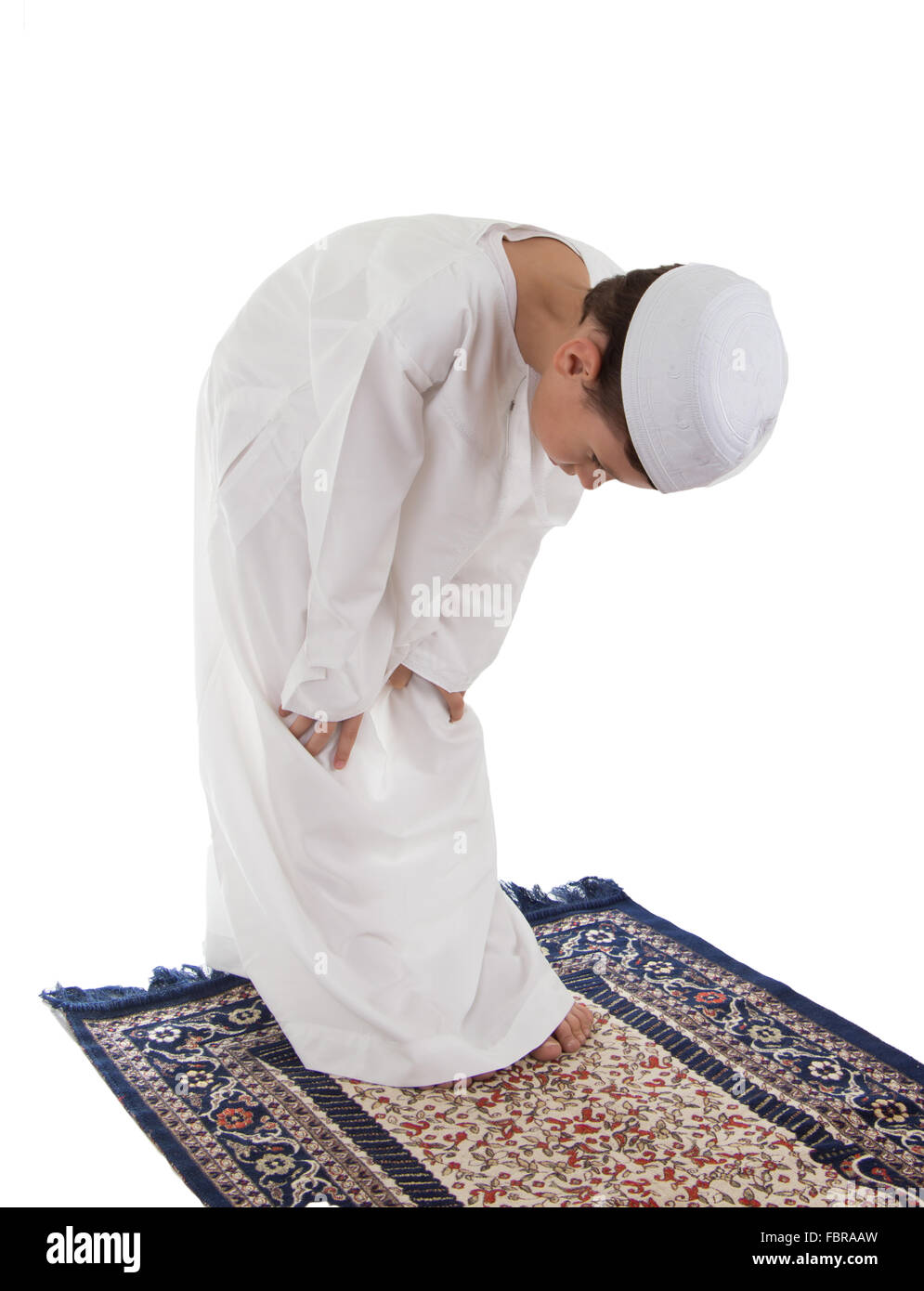 Muslim young kid praying Stock Photo - Alamy