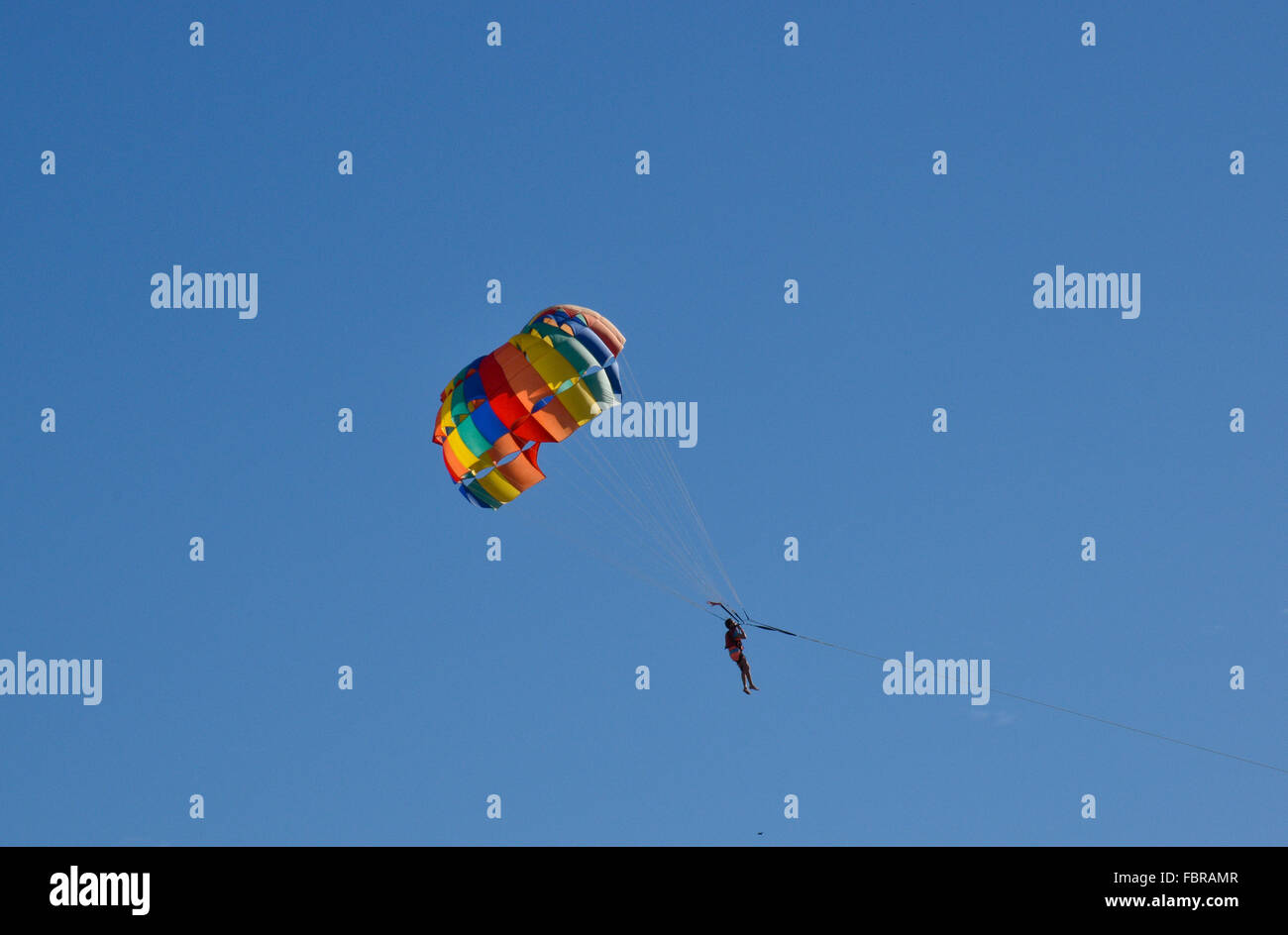 Person riding in parachute pulled by boat in Acapulco, Mexico Stock ...
