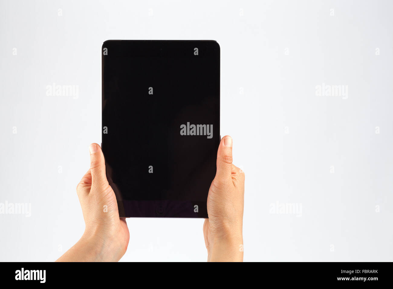 Hands holding tablet hi-res stock photography and images - Alamy