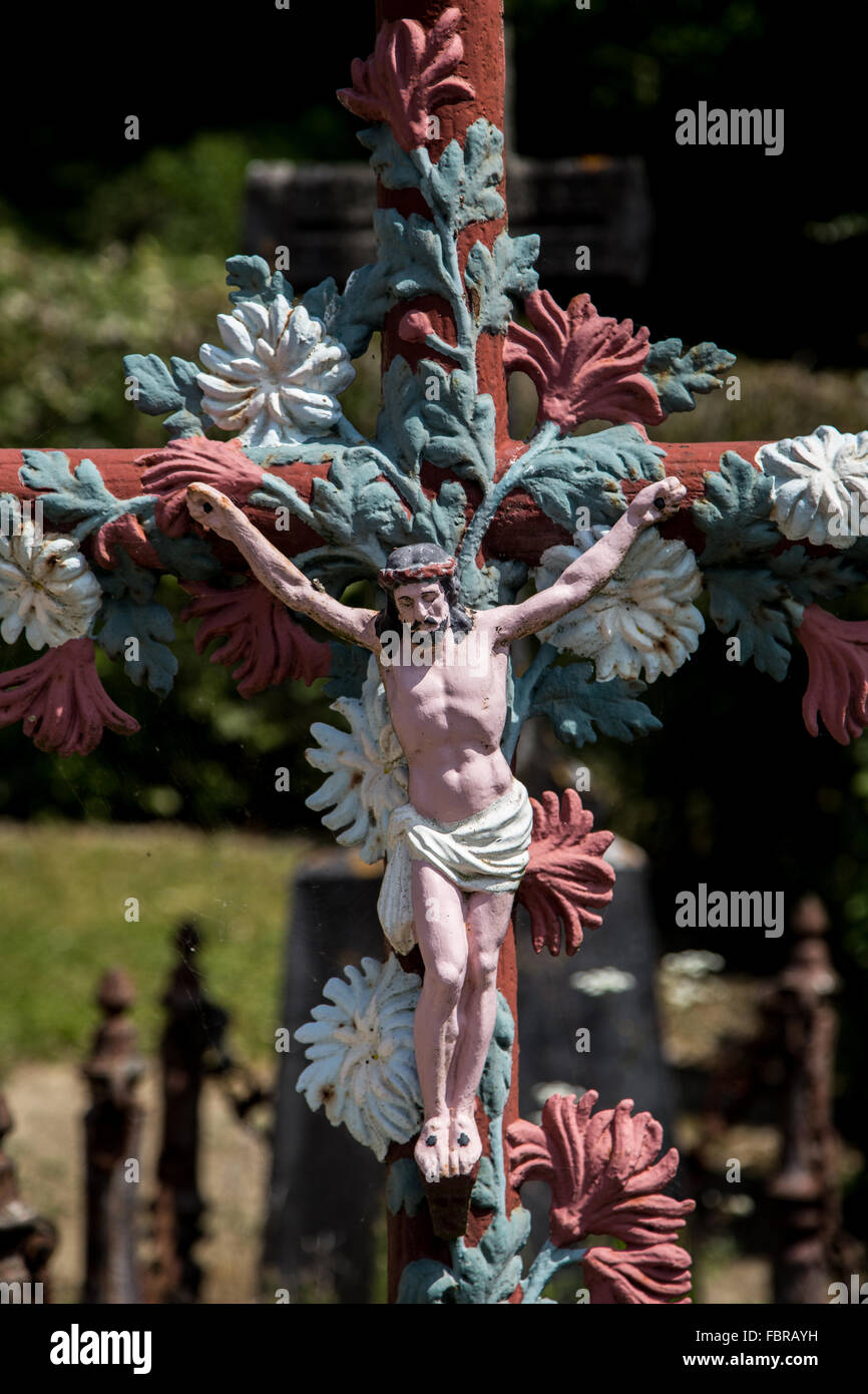 A colourful/colorful painted ornate metal iron work effigy of Jesus ...