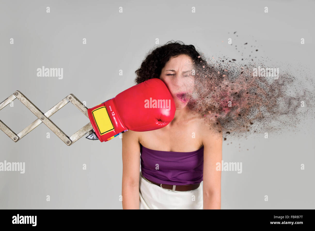 Mechanical boxing devices punches a young woman in the face with ...