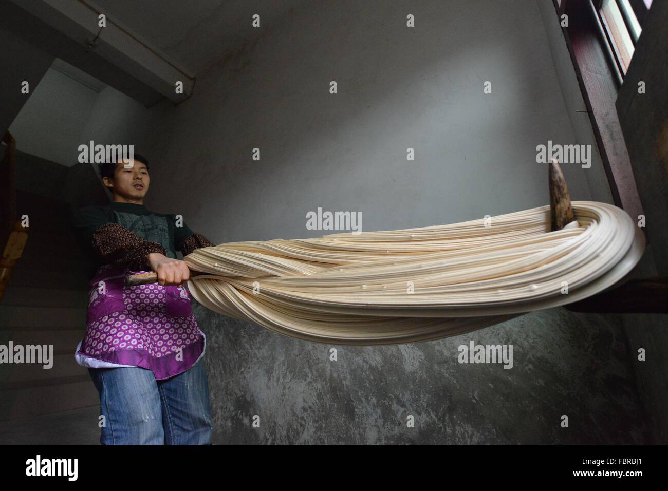 Yuqing, China's Guizhou Province. 18th Jan, 2016. A villager tries to ...