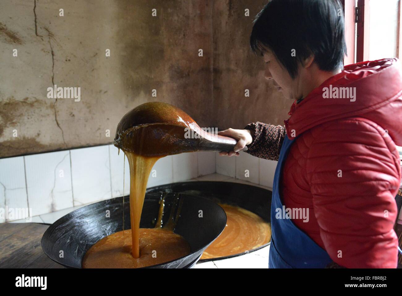 Yuqing, China's Guizhou Province. 18th Jan, 2016. A villager puts syrup ...