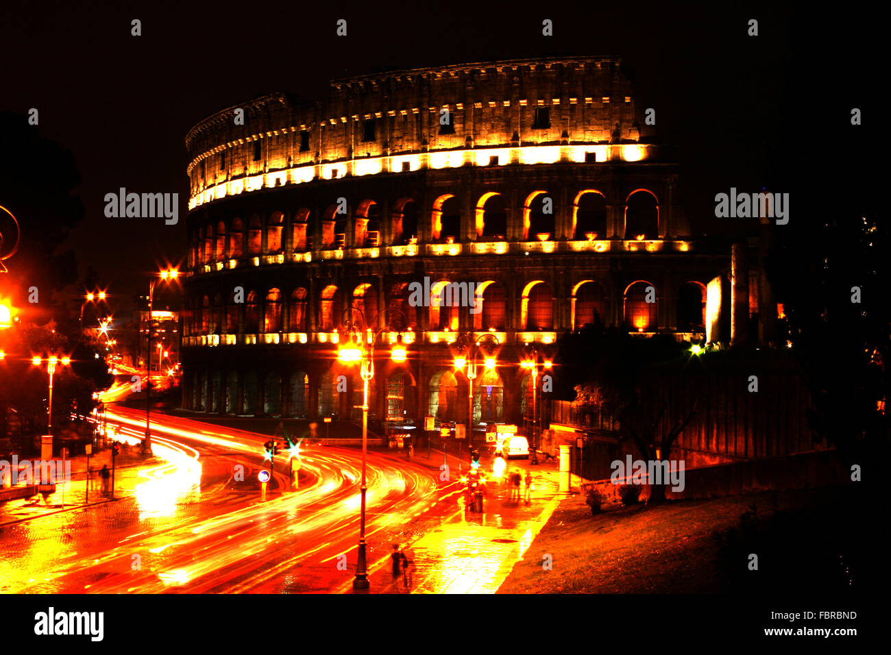 Colosseum by night & traffic light trails, Rome Italy Stock Photo - Alamy