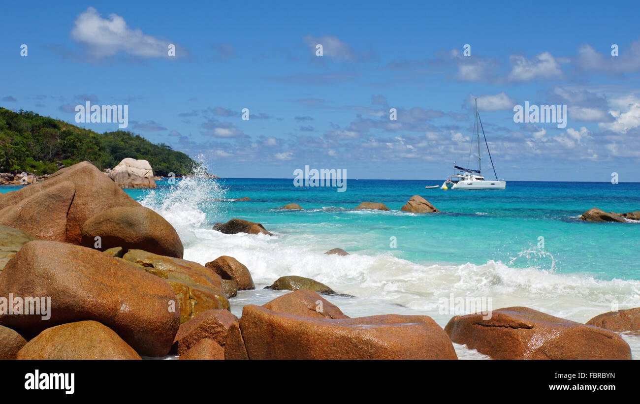 granite rocks and catamaran on seychelles Stock Photo - Alamy