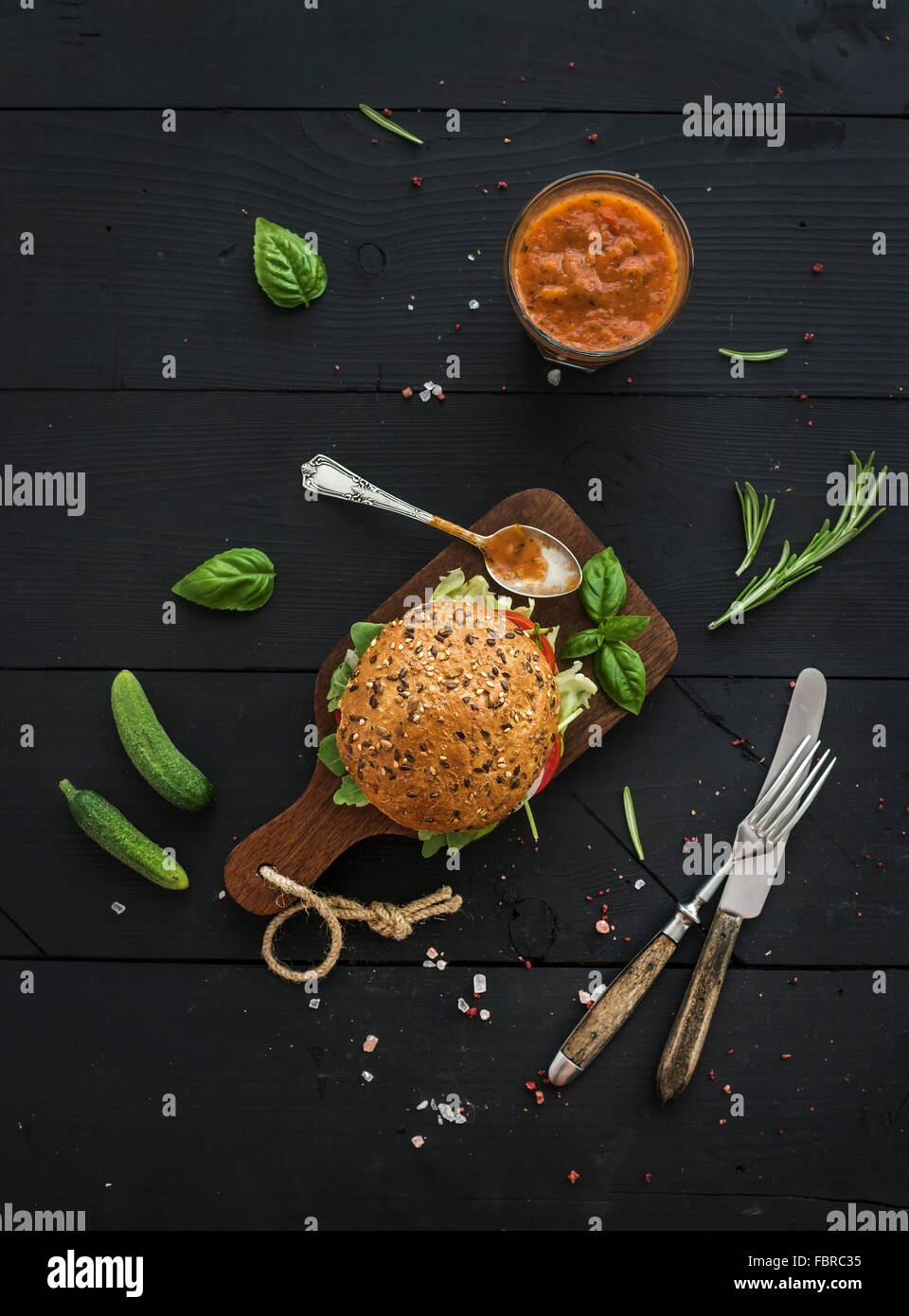 A burger on a chopping board Stock Photo - Alamy