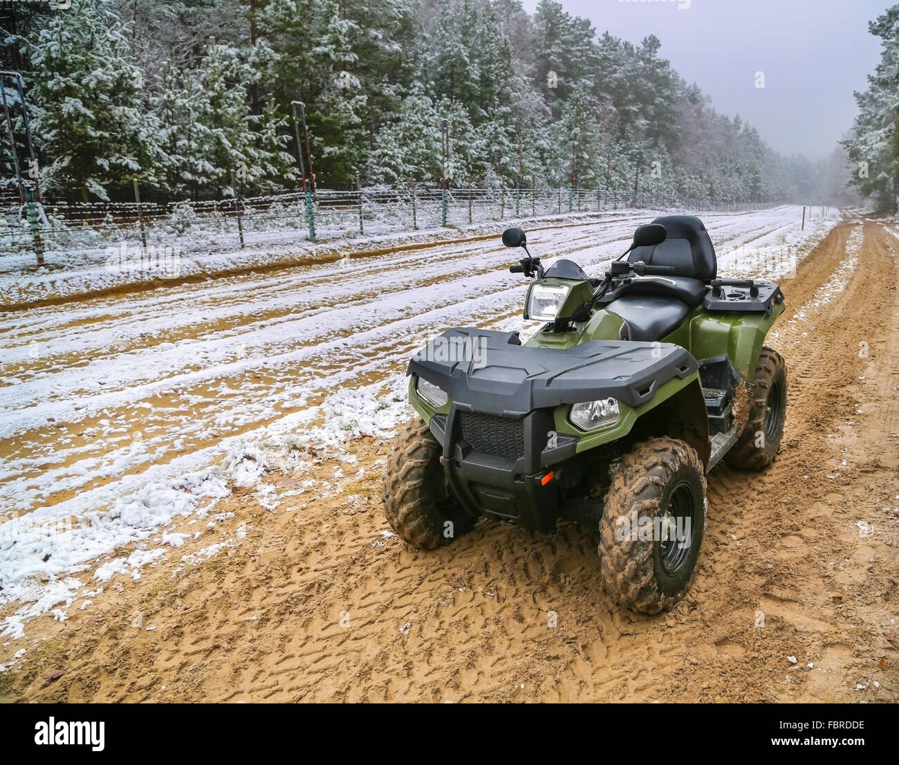 ATV stands on winter background on the state border Stock Photo - Alamy