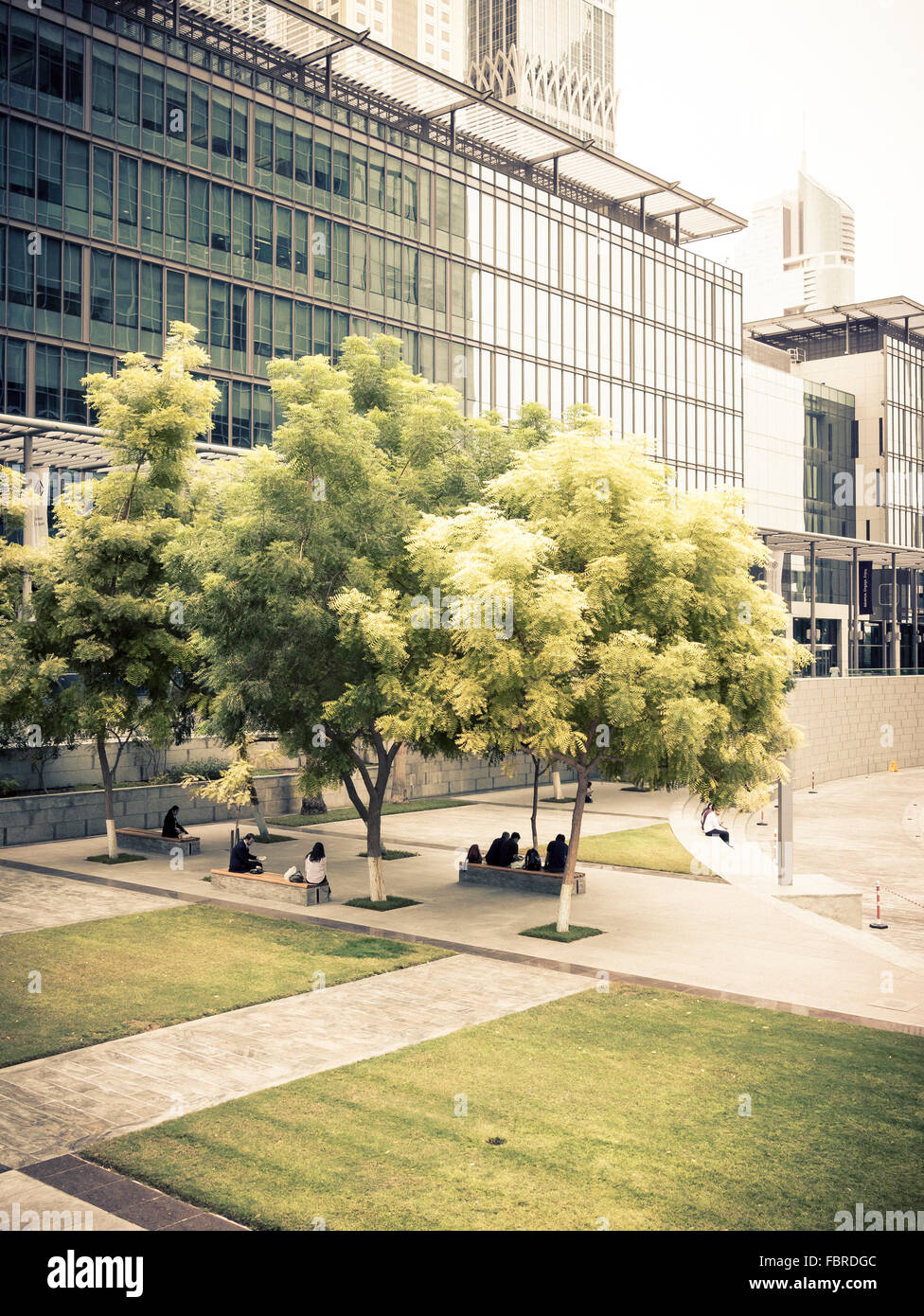 Immigrant workers relaxing, walking during lunch hour in Dubai ...