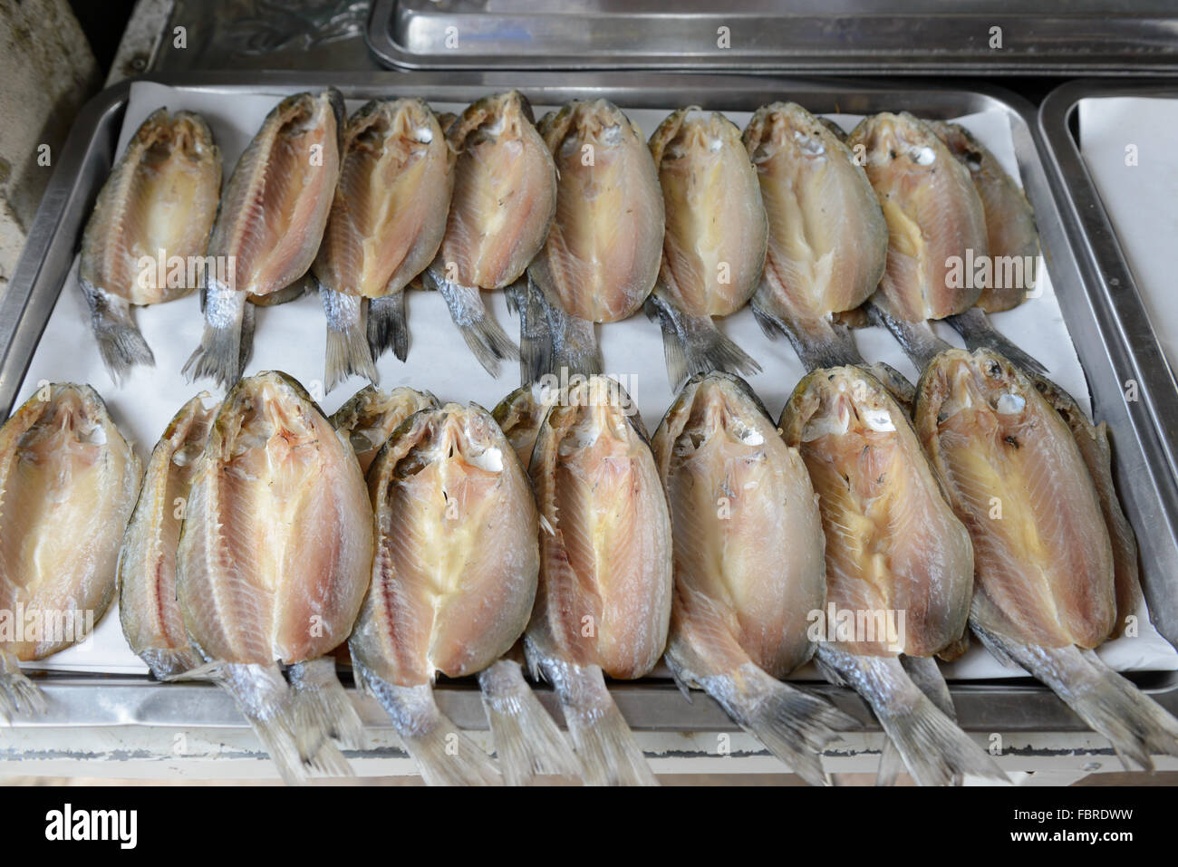 dried salted fish arranged on a tray Stock Photo - Alamy