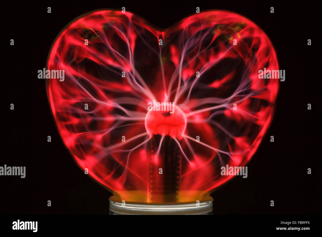Plasma ball heart glowing in the dark Stock Photo - Alamy