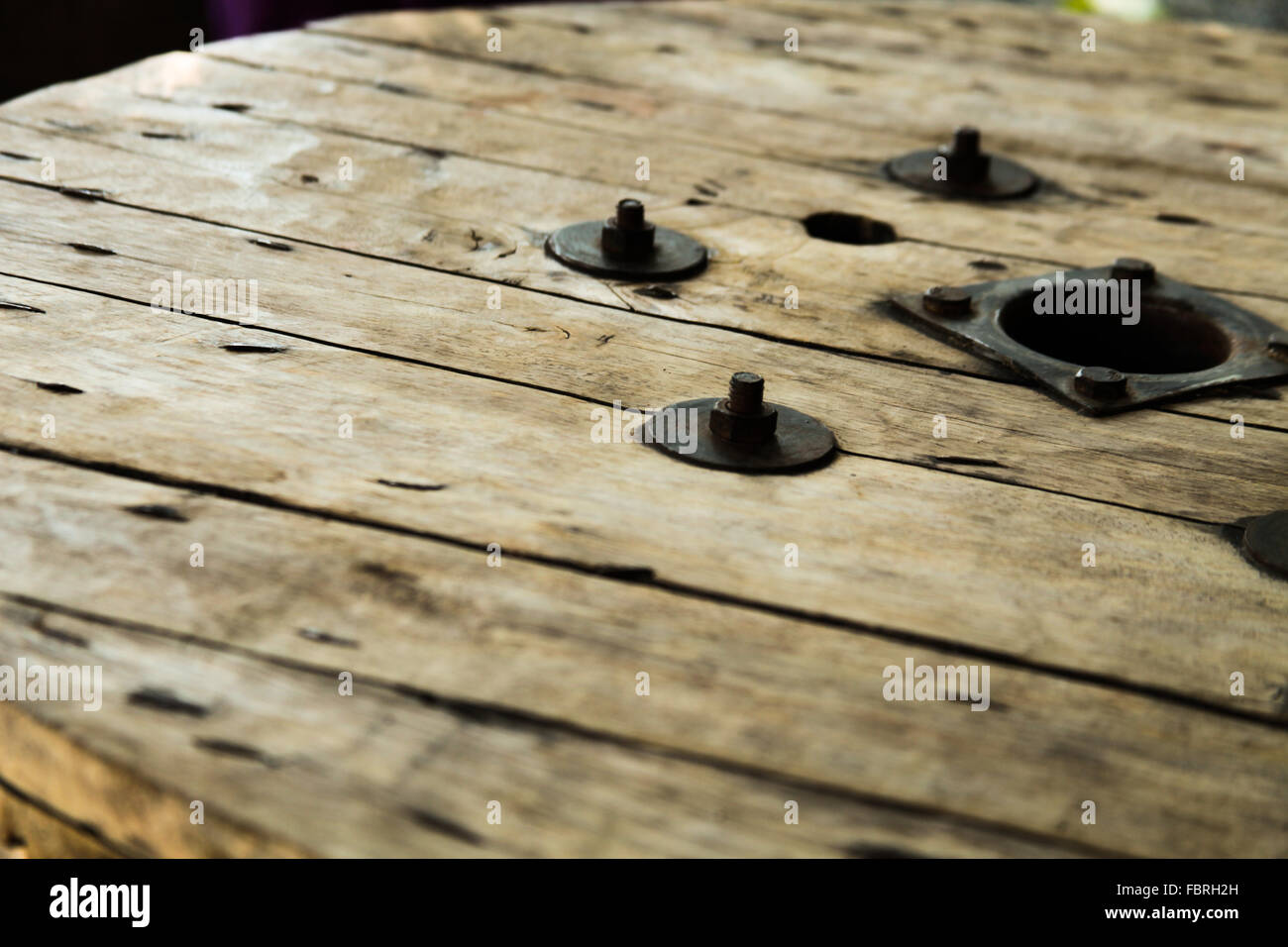 Chiang Mai, Thailand, 2016. Reused wooden cable roll used as a table in ...