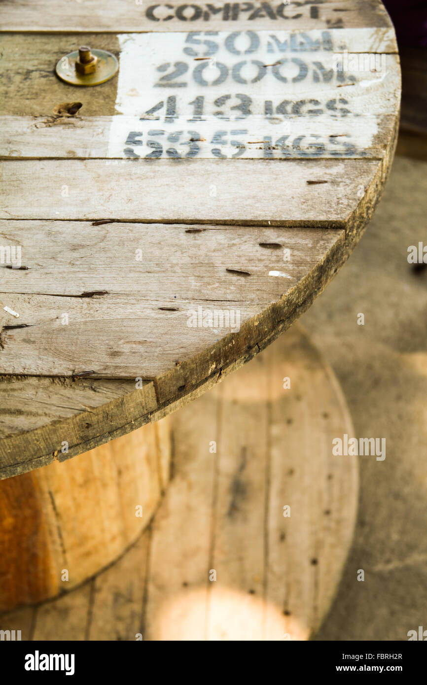 Chiang Mai, Thailand, 2016. Reused wooden cable roll used as a table in ...