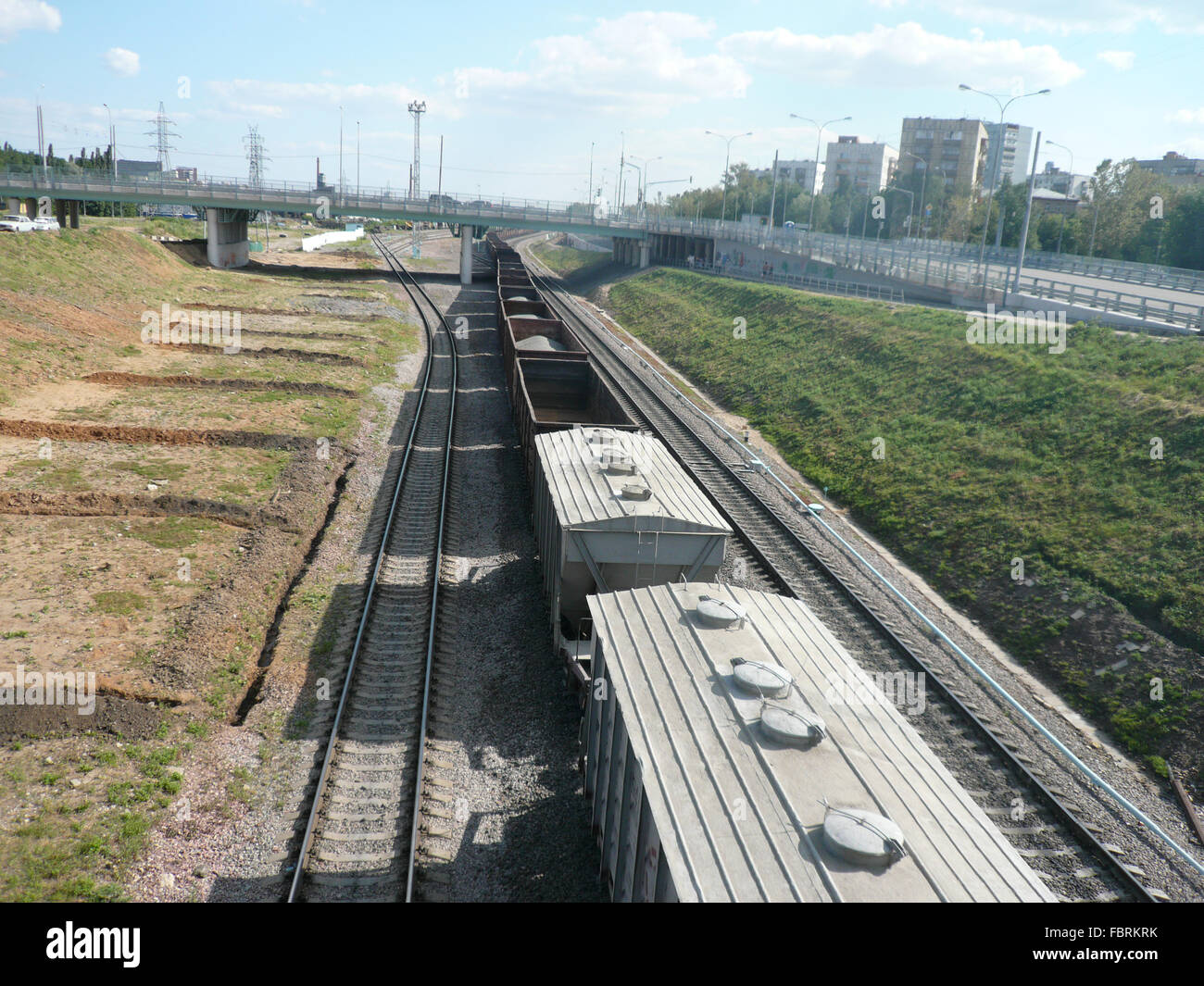 goods train with bulk cargo at sunny day Stock Photo - Alamy