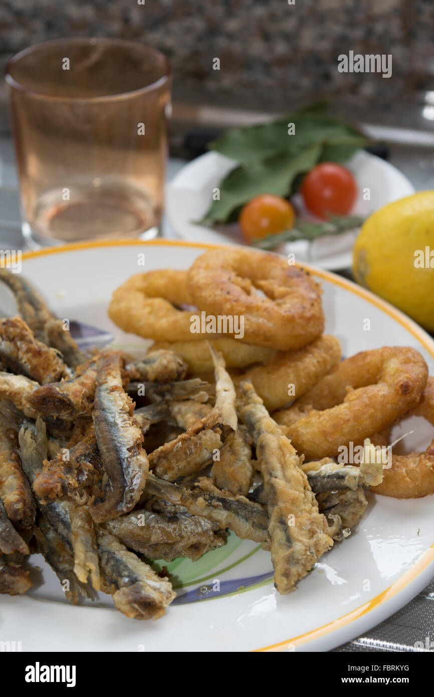 mixed fish fry with anchovied and battered calamari Stock Photo - Alamy